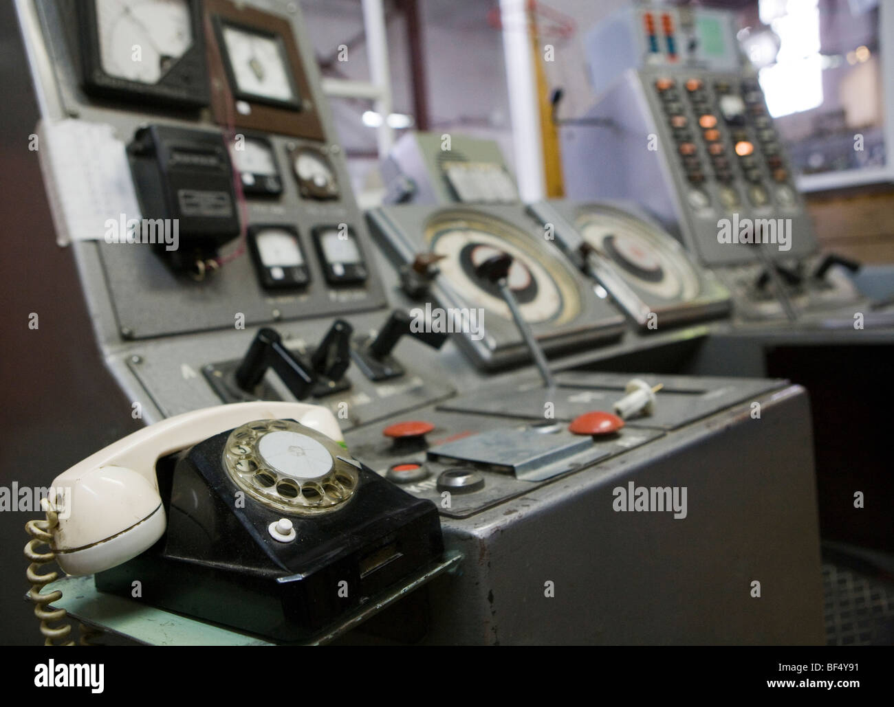 Vintage telephone beside industrial control panel Stock Photo - Alamy