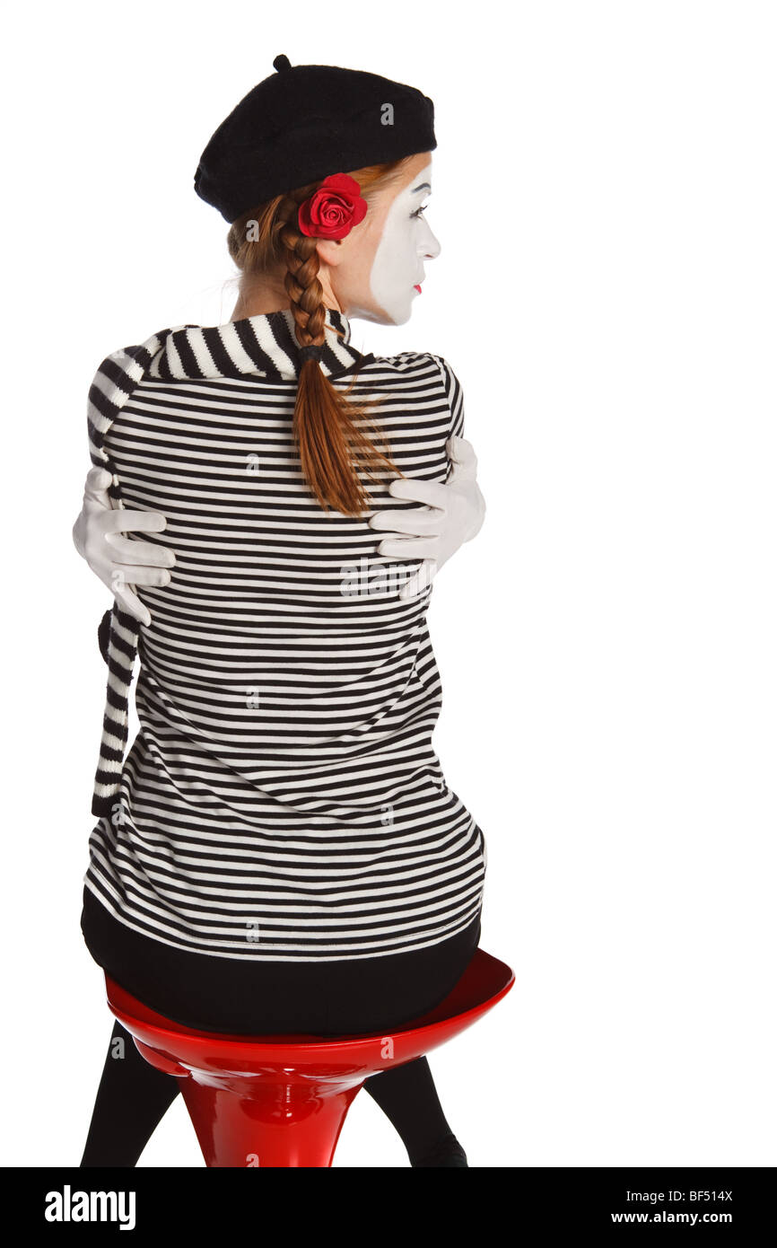Portrait of a young lady dressed up as a mime isolated on white ...