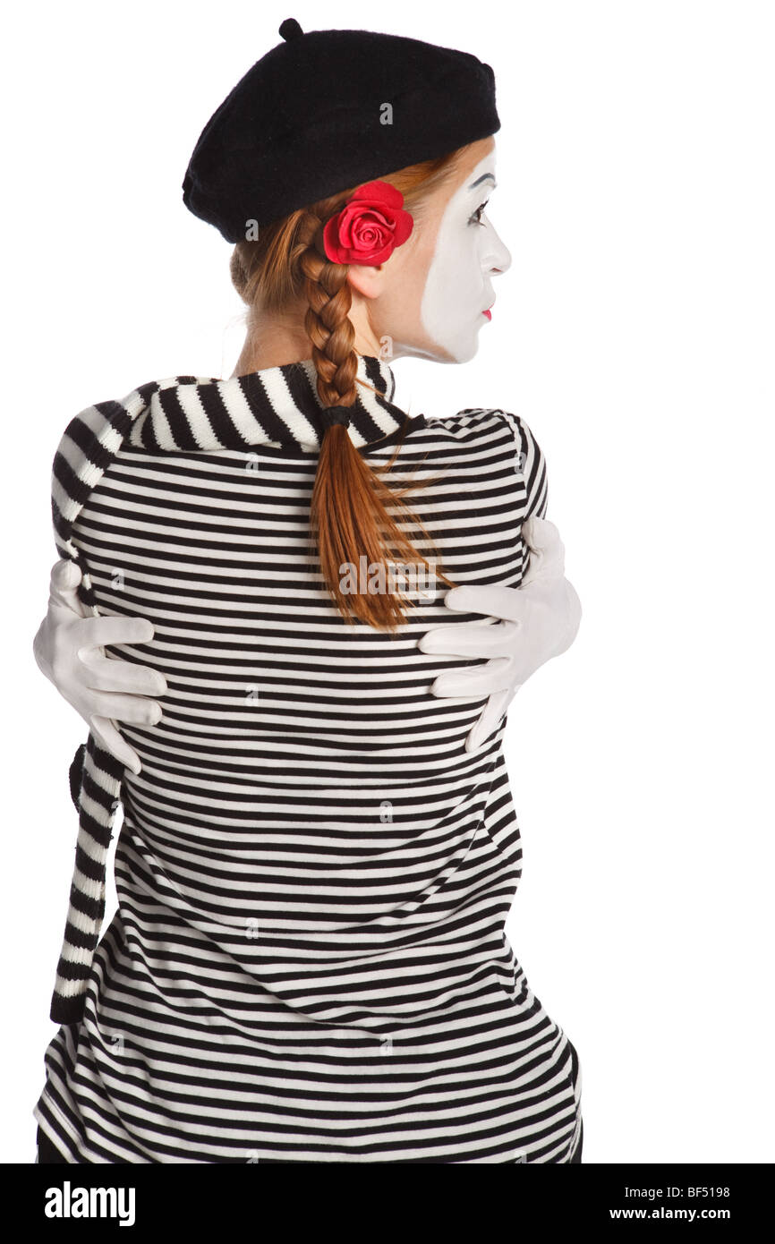 Portrait of a young lady dressed up as a mime isolated on white ...