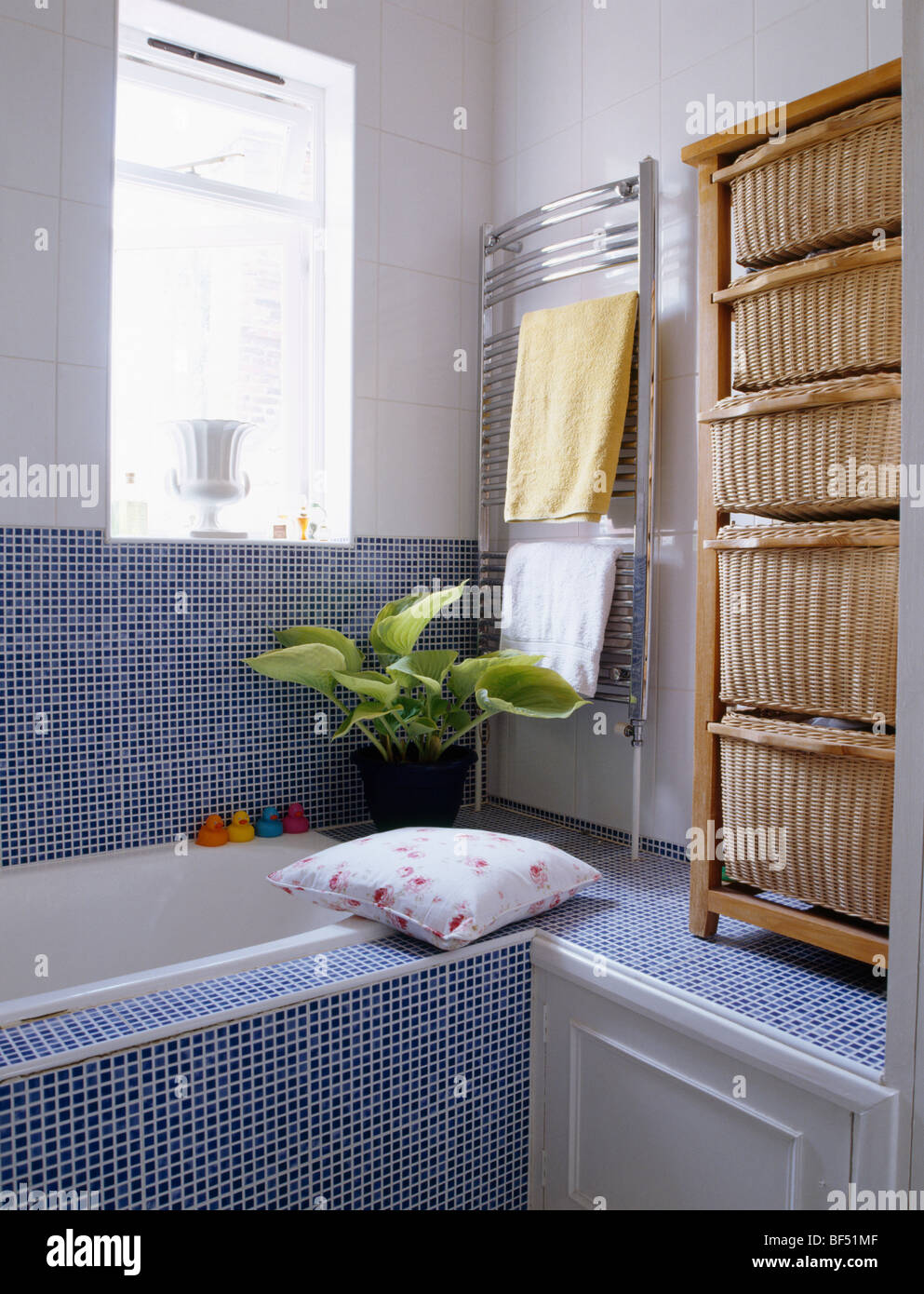Blue mosaic-tiled wall bath surround in small bathroom with tall ...