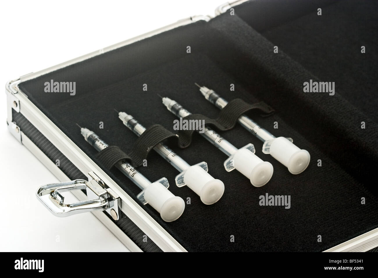 Row of syringes in a black case Stock Photo - Alamy