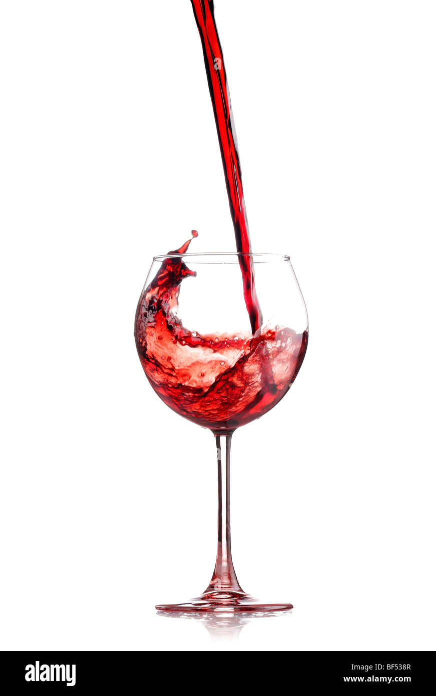 red wine splashing in a glass, isolated on white Stock Photo - Alamy
