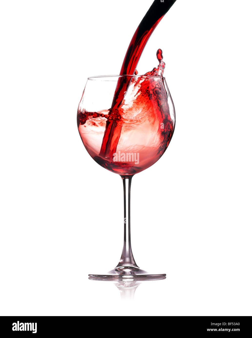 red wine splashing in a glass, isolated on white Stock Photo - Alamy