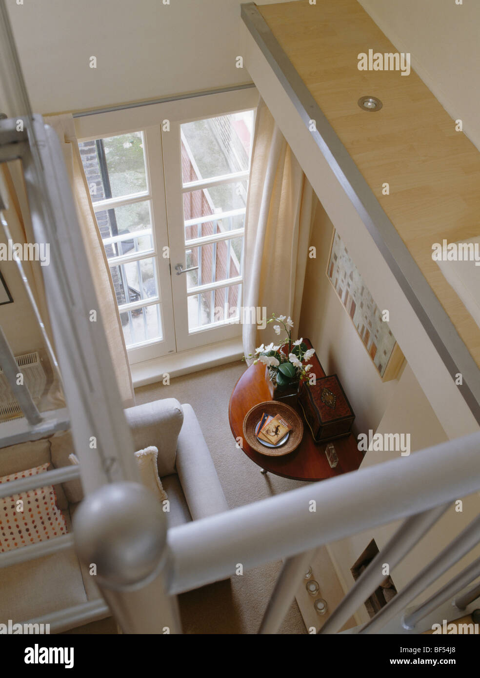 Birdseye view from landing of living room in town studio apartment ...