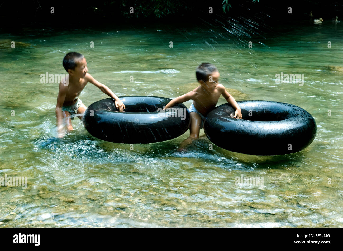 Boys Playing By River High Resolution Stock Photography and Images - Alamy