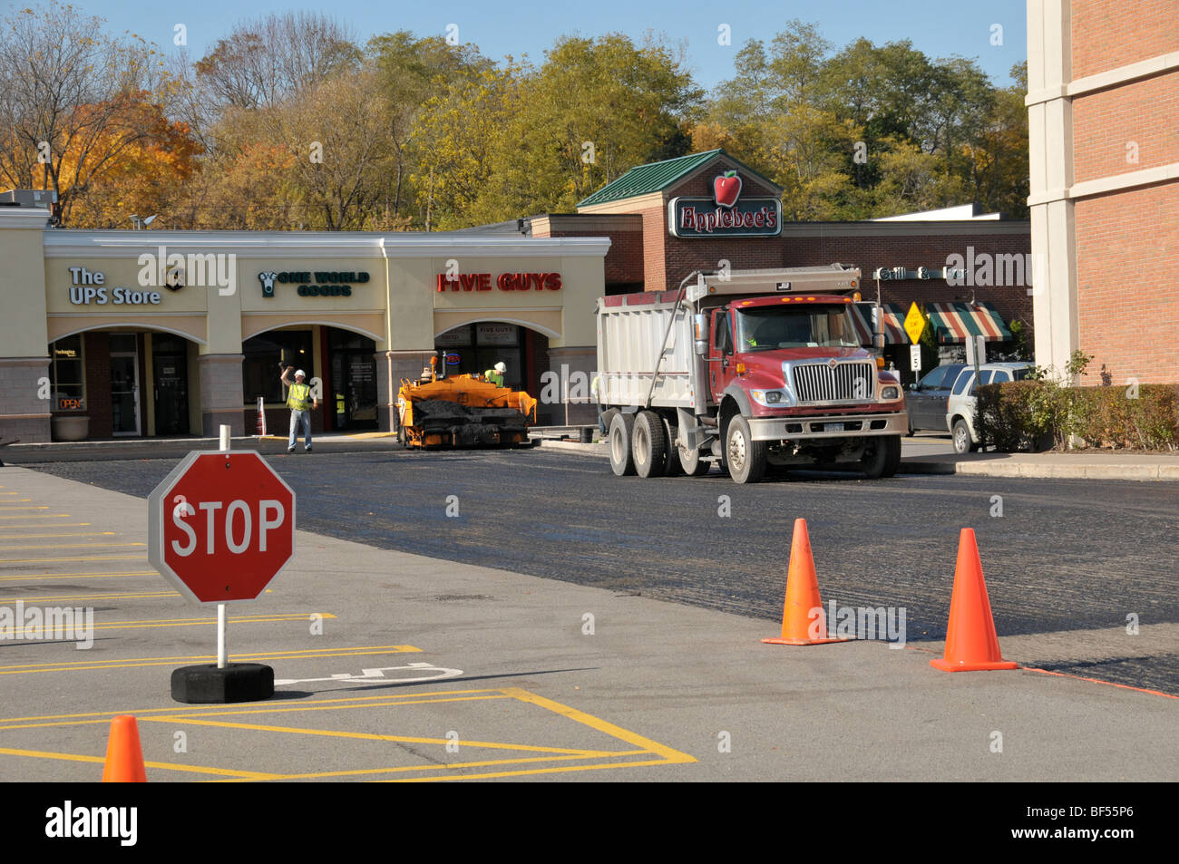Workers lay new blacktop at shopping mall Stock Photo - Alamy