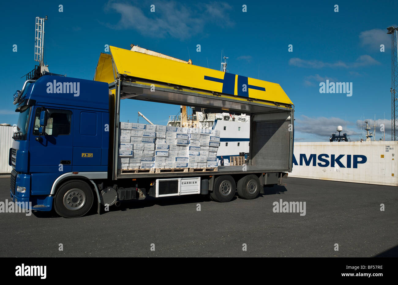 Unloading fresh fish, frozen at sea, Hafnarfjordur Harbor, Iceland ...