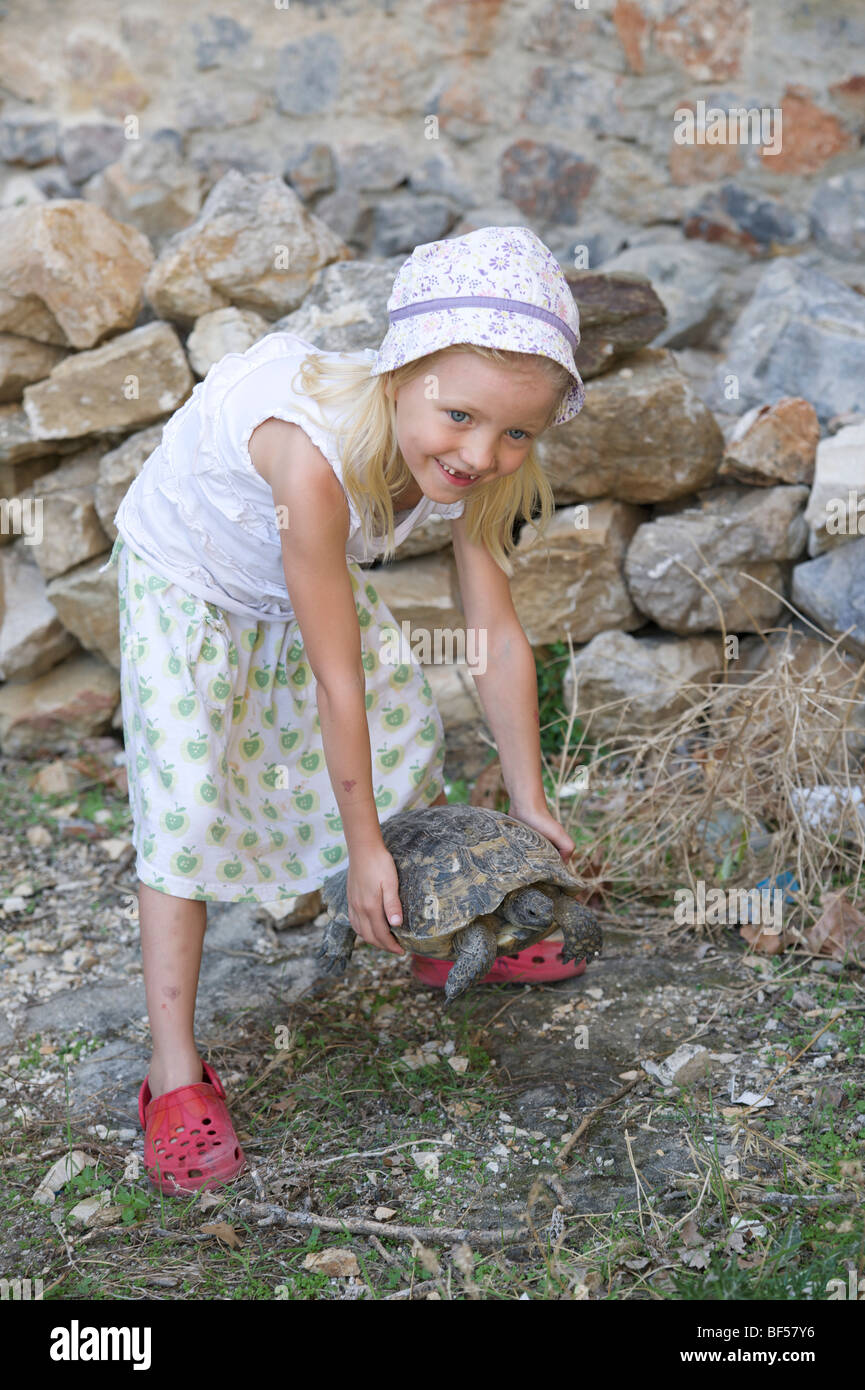 Girl with a turtle near Anamur, Turkey Stock Photo - Alamy