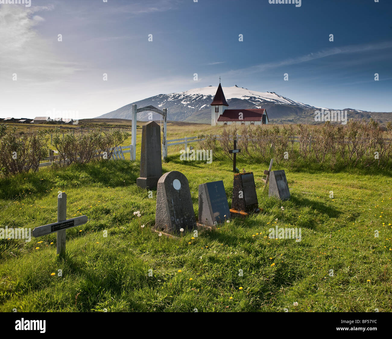 Graveyard and church with Snaefellsjokull glacier, Hellnar, Iceland ...