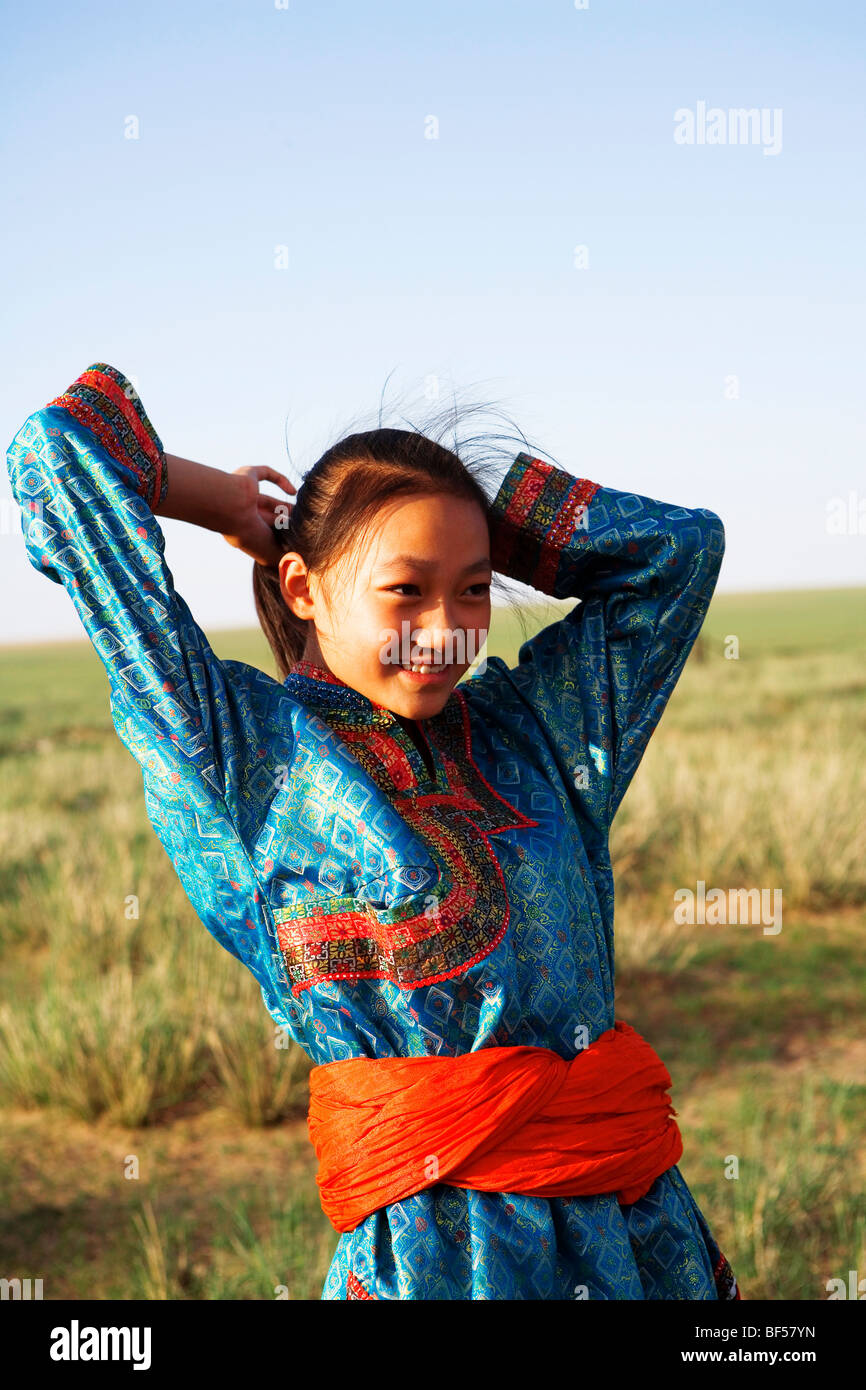 Mongolian woman in traditional costume, Hulun Buir Grassland Stock ...