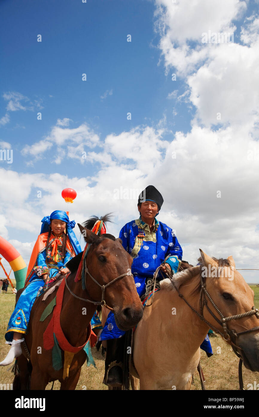 Monglian people in traditional costume riding horses, Xilamuren ...