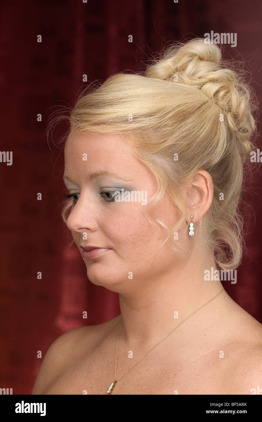 A traditional and beautifully styled bride waiting to step into her ...
