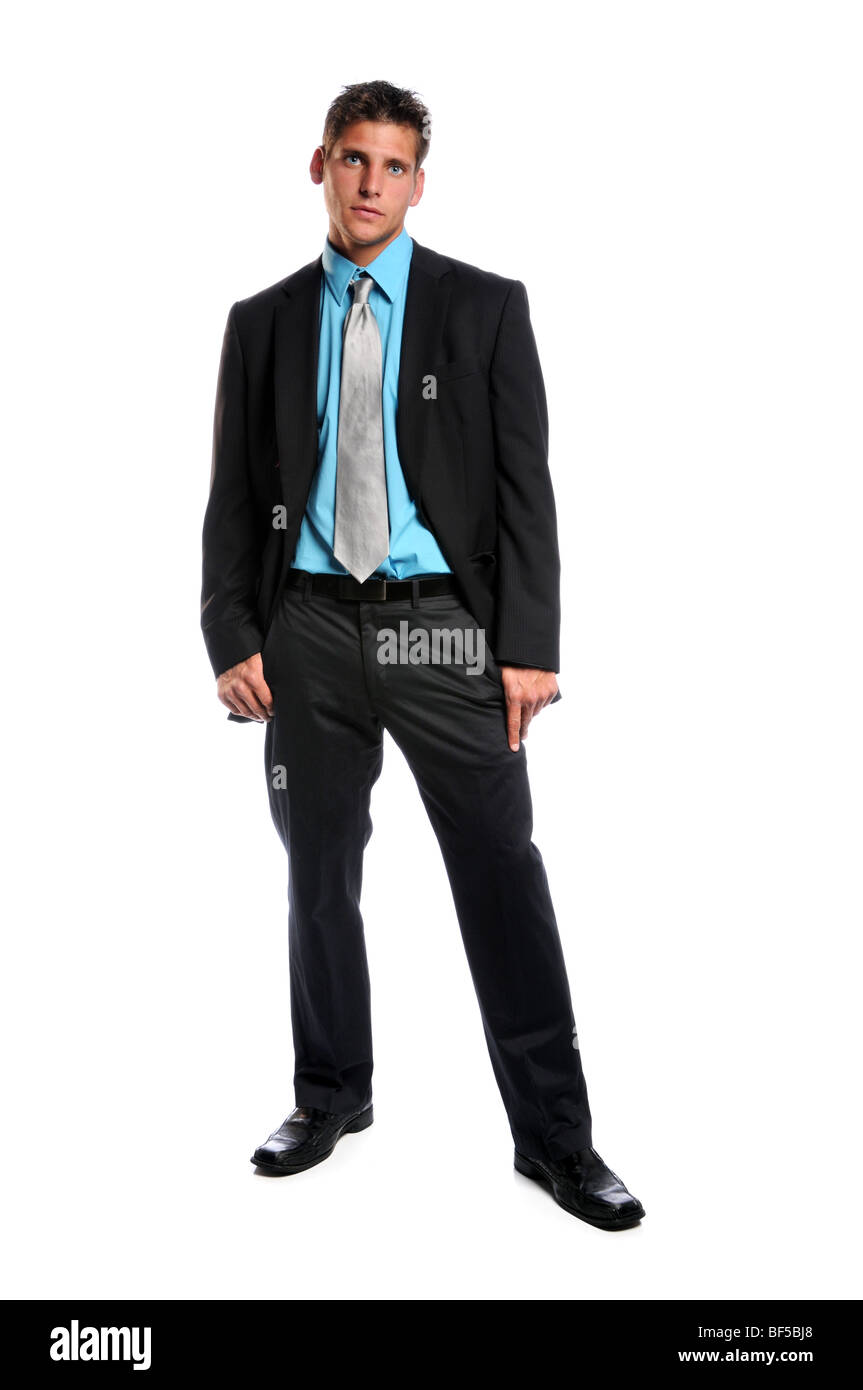 Portrait of young businessman standing isolated over white background ...