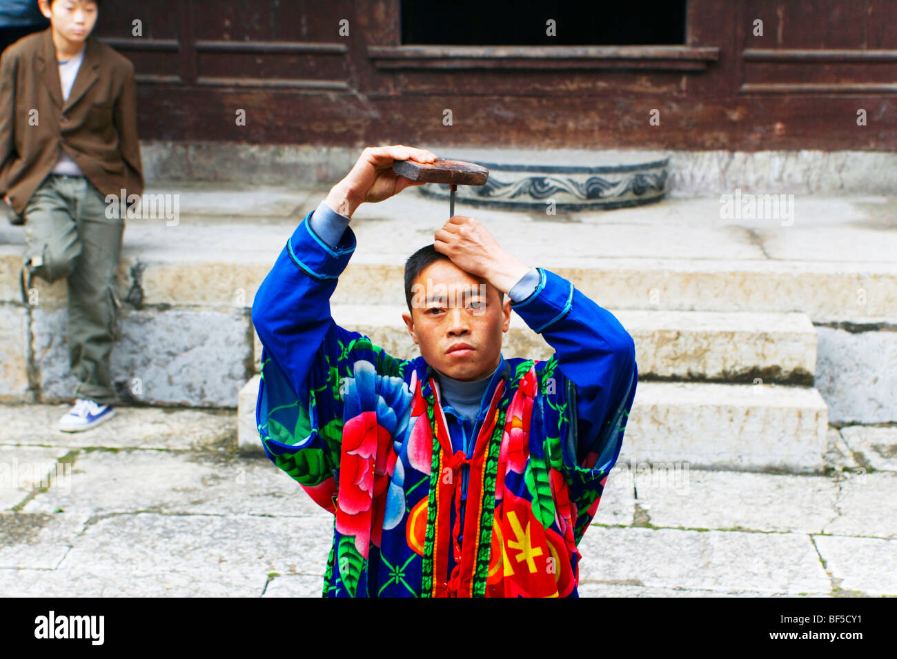 Nuo Opera actor drilling a hole on his scalp during ritual before ...