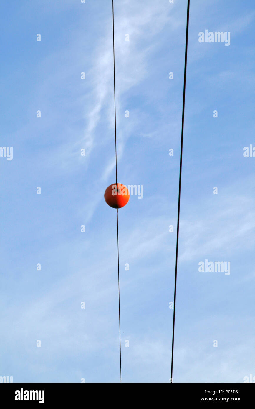 Power lines, transmission line, orange marker as identification of air ...