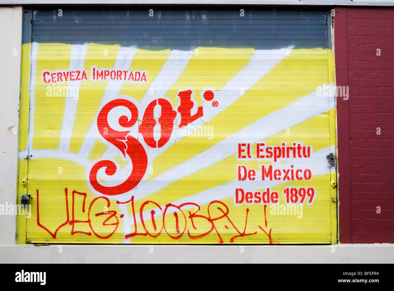 SOL painting on the shutter, Brick Lane in East End, East London ...
