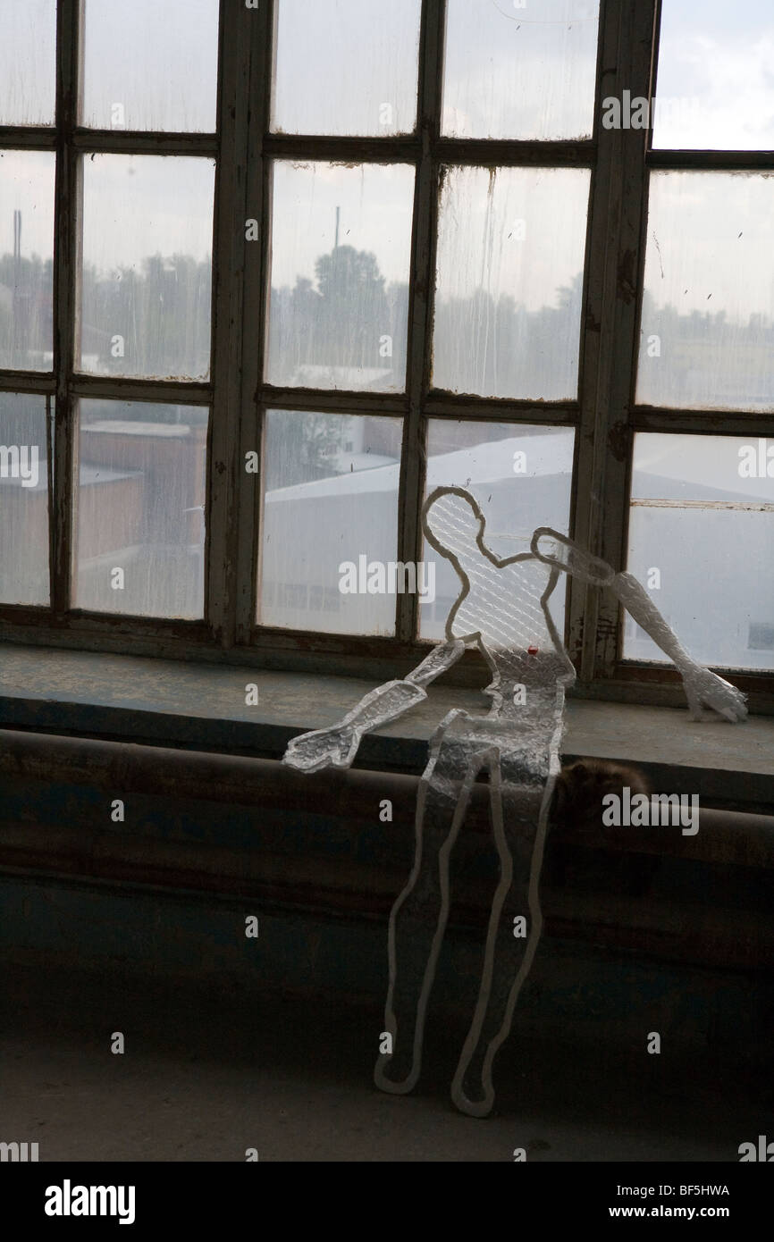 Yekaterinburg seen through dirty windows of factory, Russia. Man-like ...