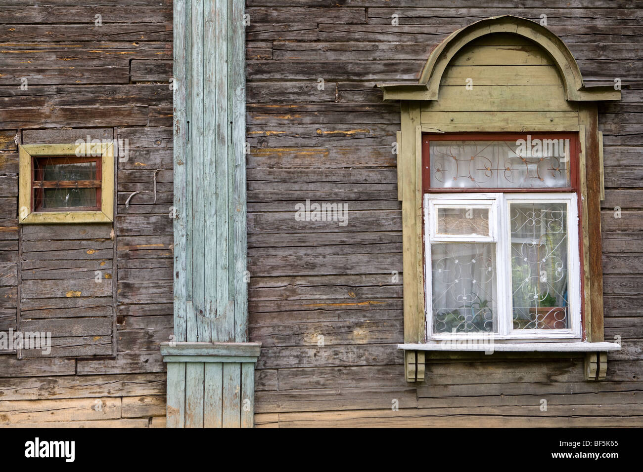 Small and large windows on facade of traditional wooden buildings, Ural ...