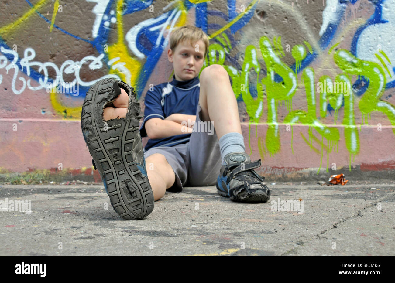 9-year-old boy, bored, football ground in Cologne, North Rhine ...
