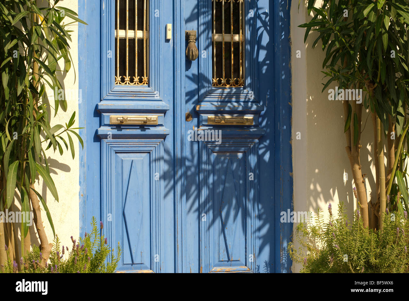 Typical Cretan style front double door entrance Stock Photo - Alamy