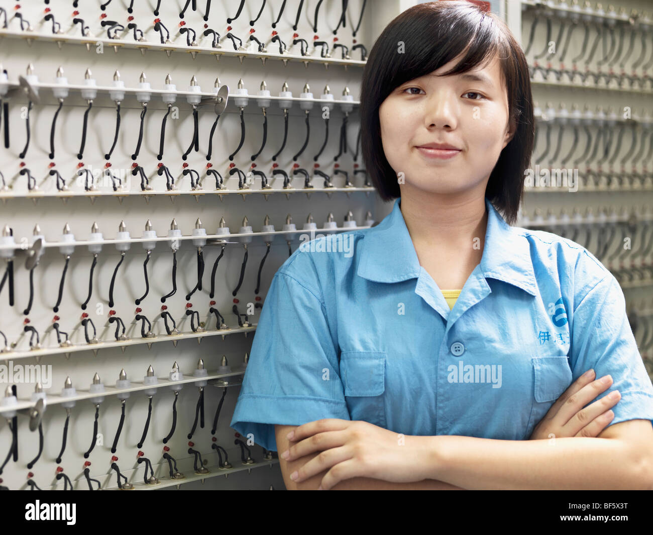 A portrait of a young factory employee in her uniform Stock Photo - Alamy