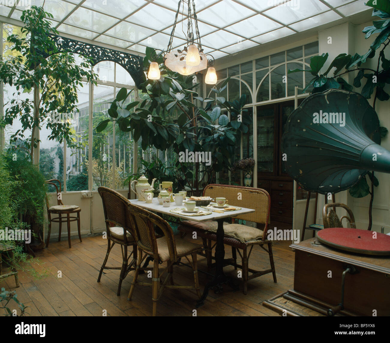 Thirties light fitting above table set for breakfast in traditional ...