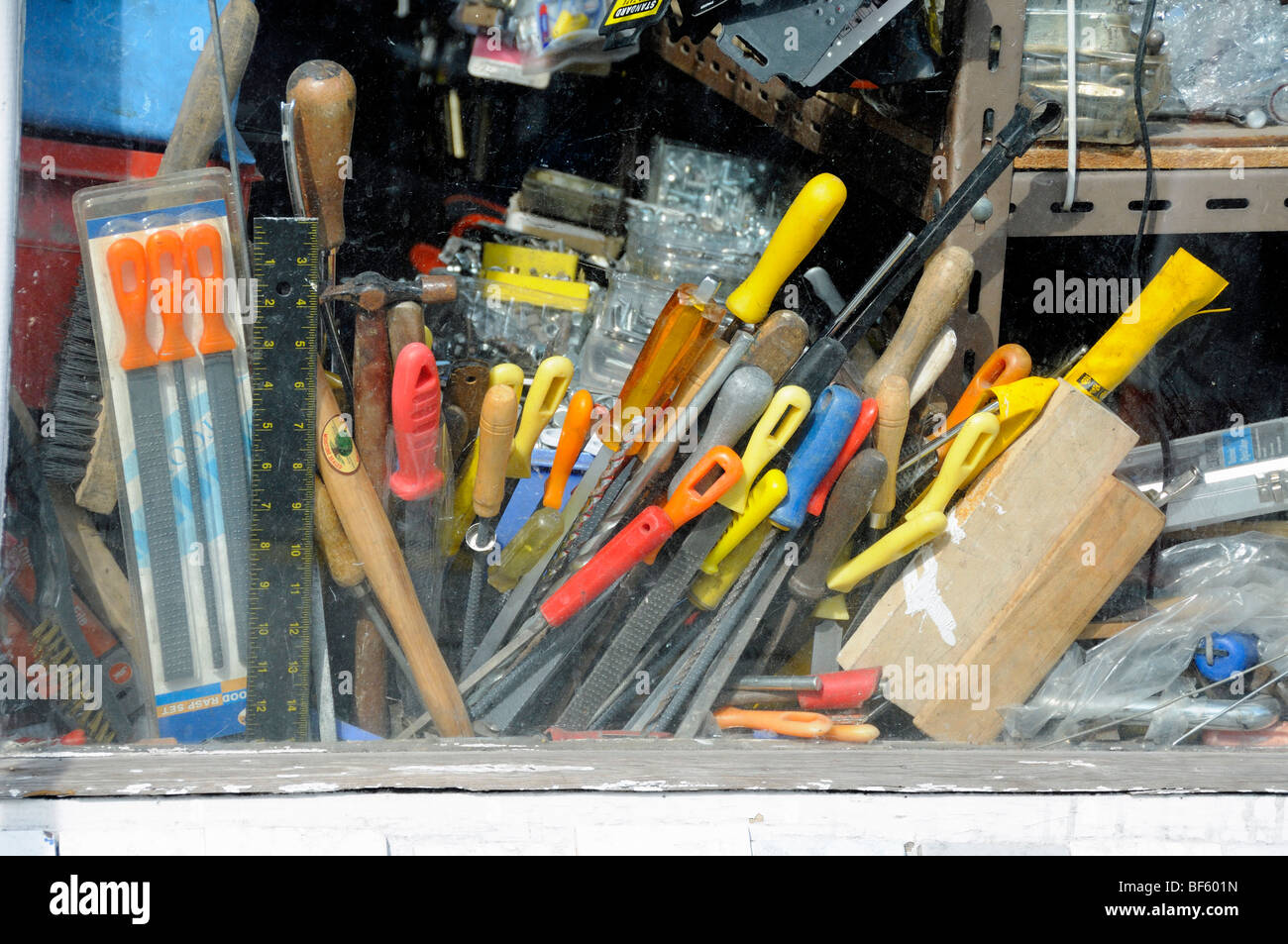 Tools in shop window Stock Photo - Alamy