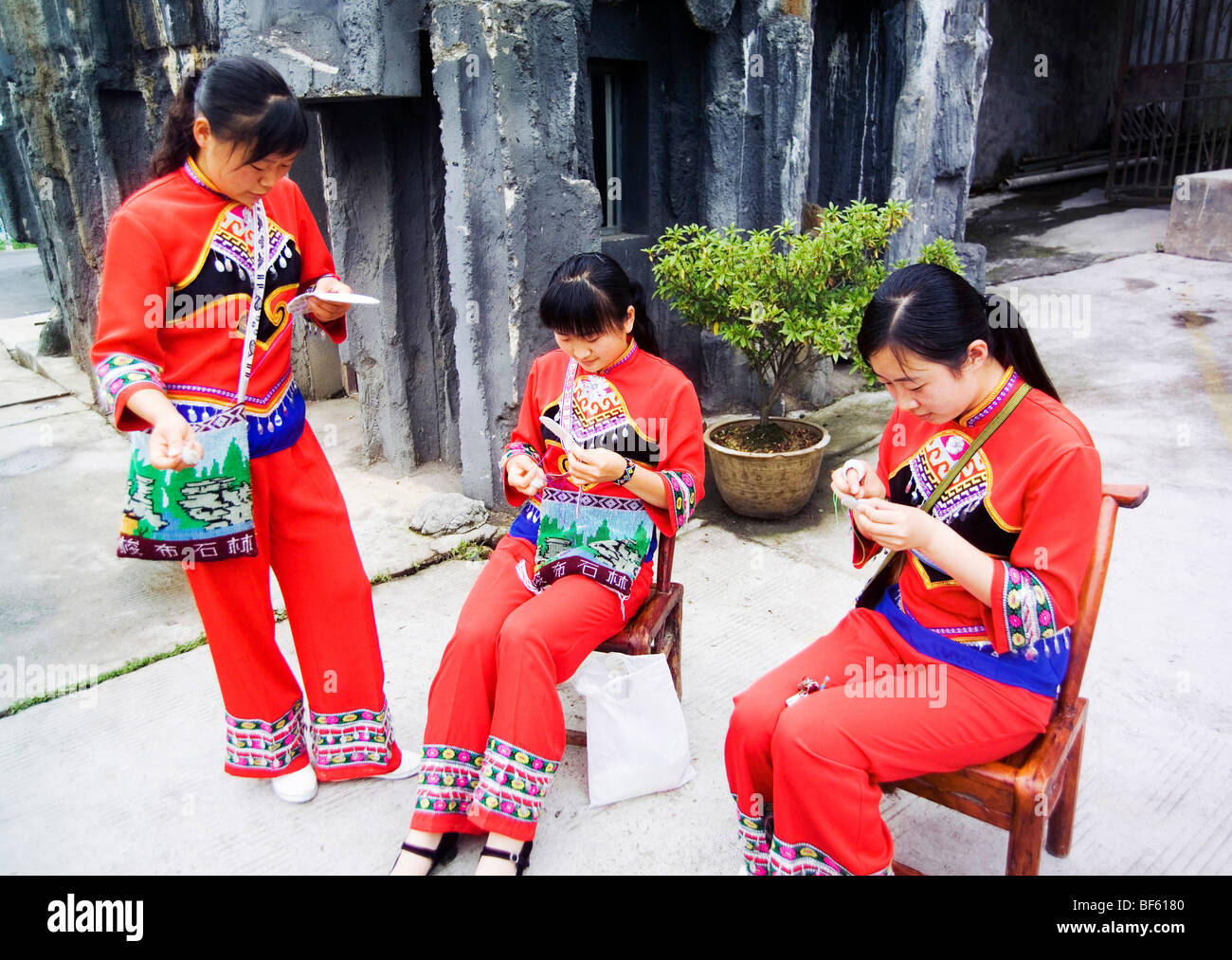 Tujia women in traditional costume sewing, Taiyanghexiang County, Enshi ...