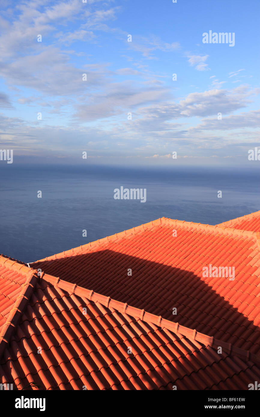 rooftops of houses high above the Atlantic ocean. Photo by Willy ...