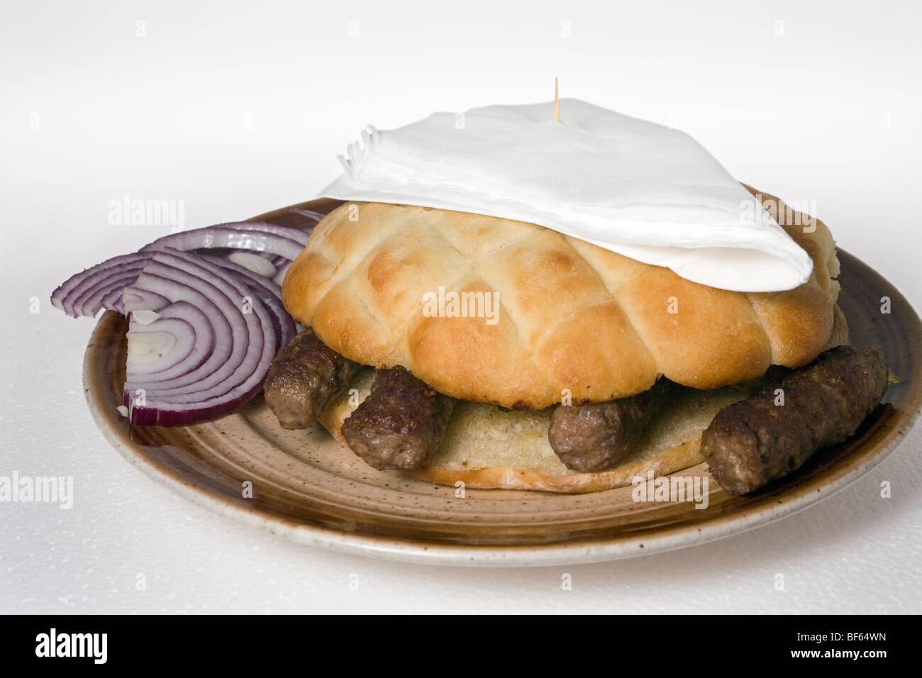 Cevapcici. Bosnian fast food. Grilled meat rolls in somun bread simply ...