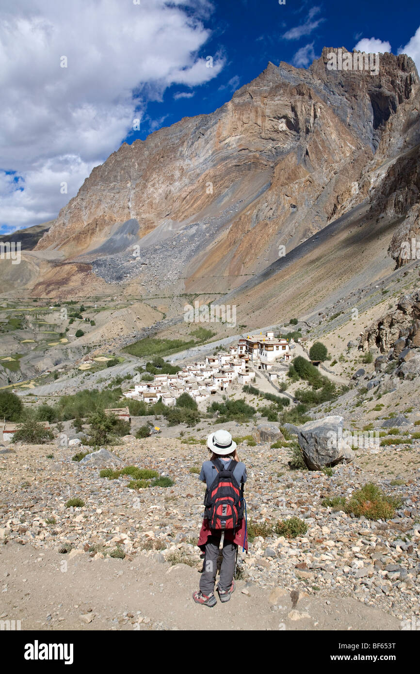 Trekker photographing Lingshed monastery. Padum-Lamayuru trek. Zanskar ...