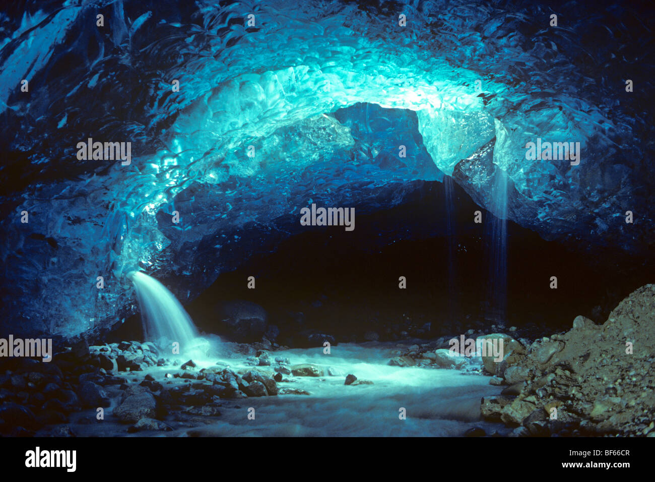 Ice cave with waterfall inside melting glacier ice, Glacier Bay ...