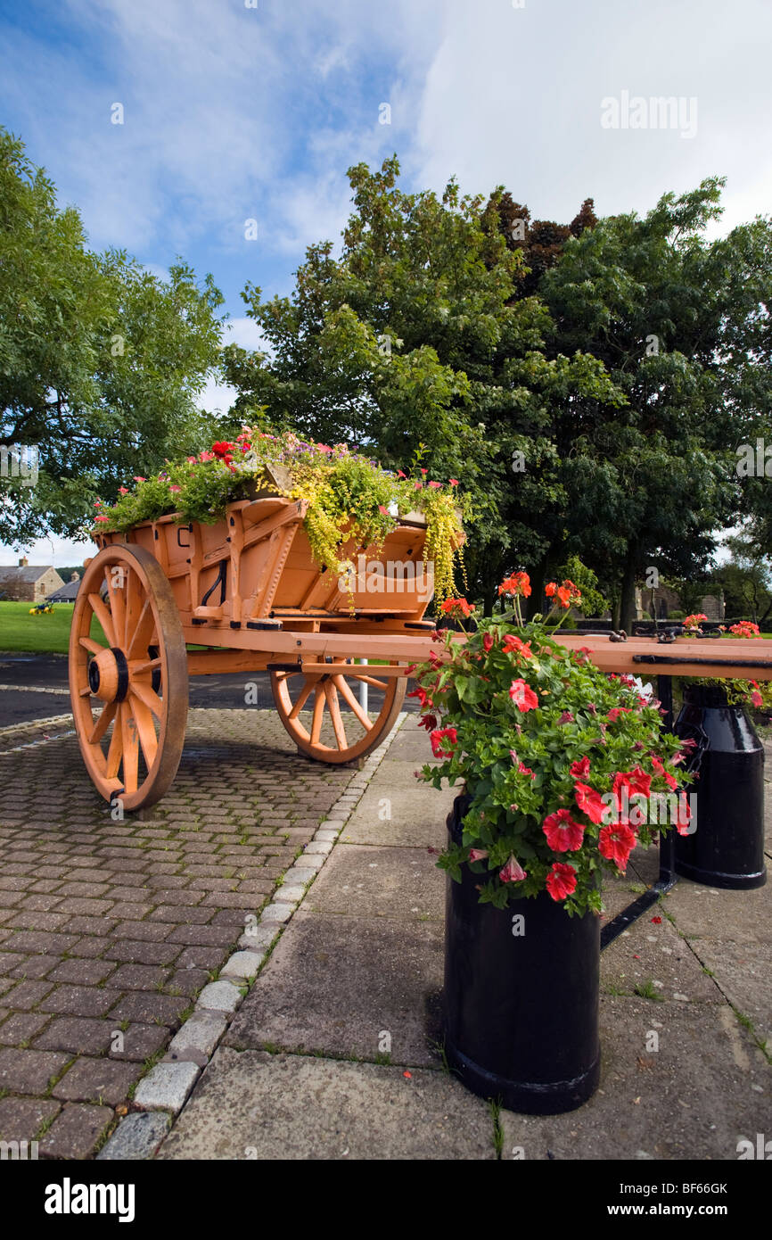 Floral display in old cart in Chipping, Lancashire Stock Photo - Alamy