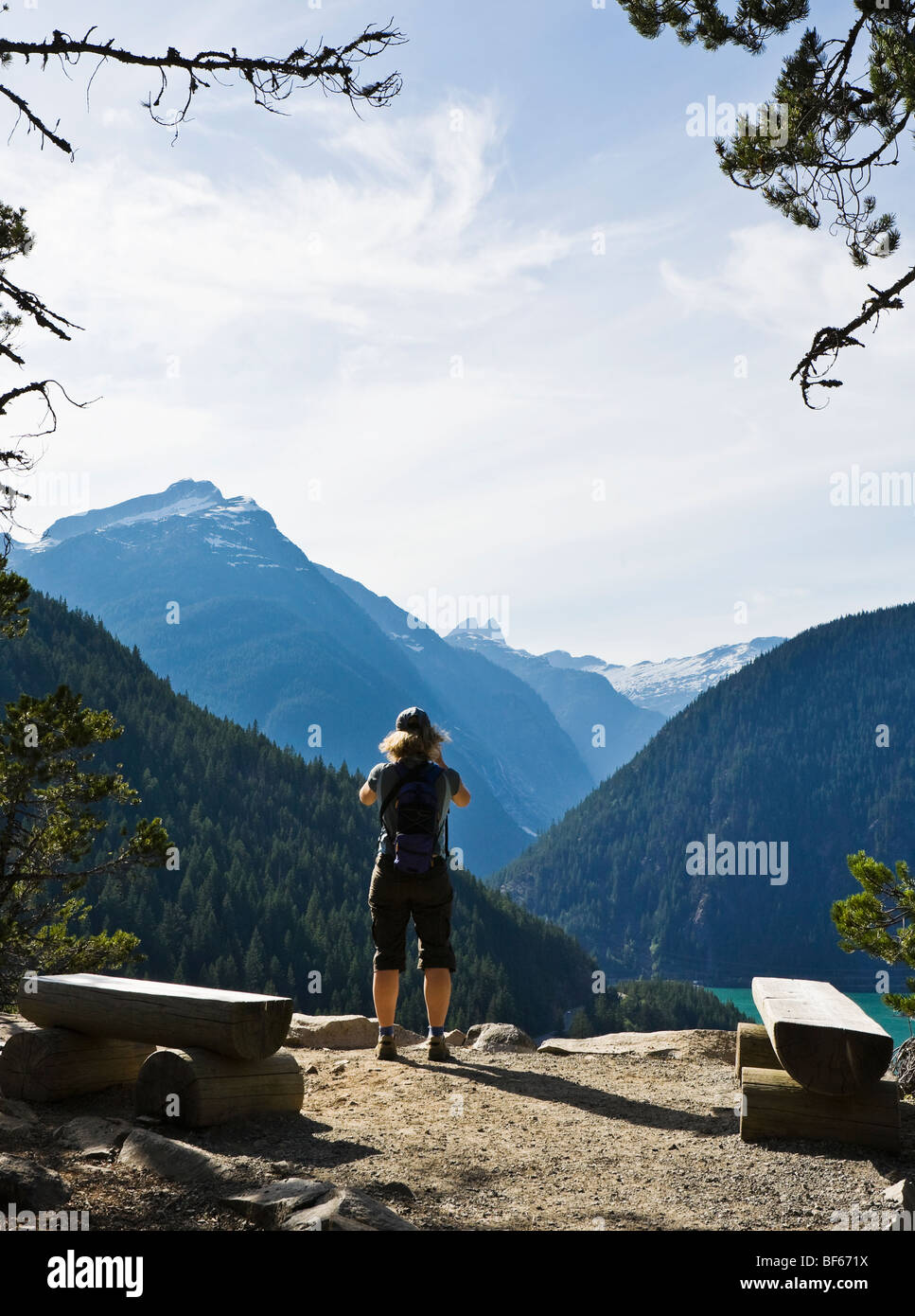 A woman standing taking a picture at a Thunder Knob overlook above ...