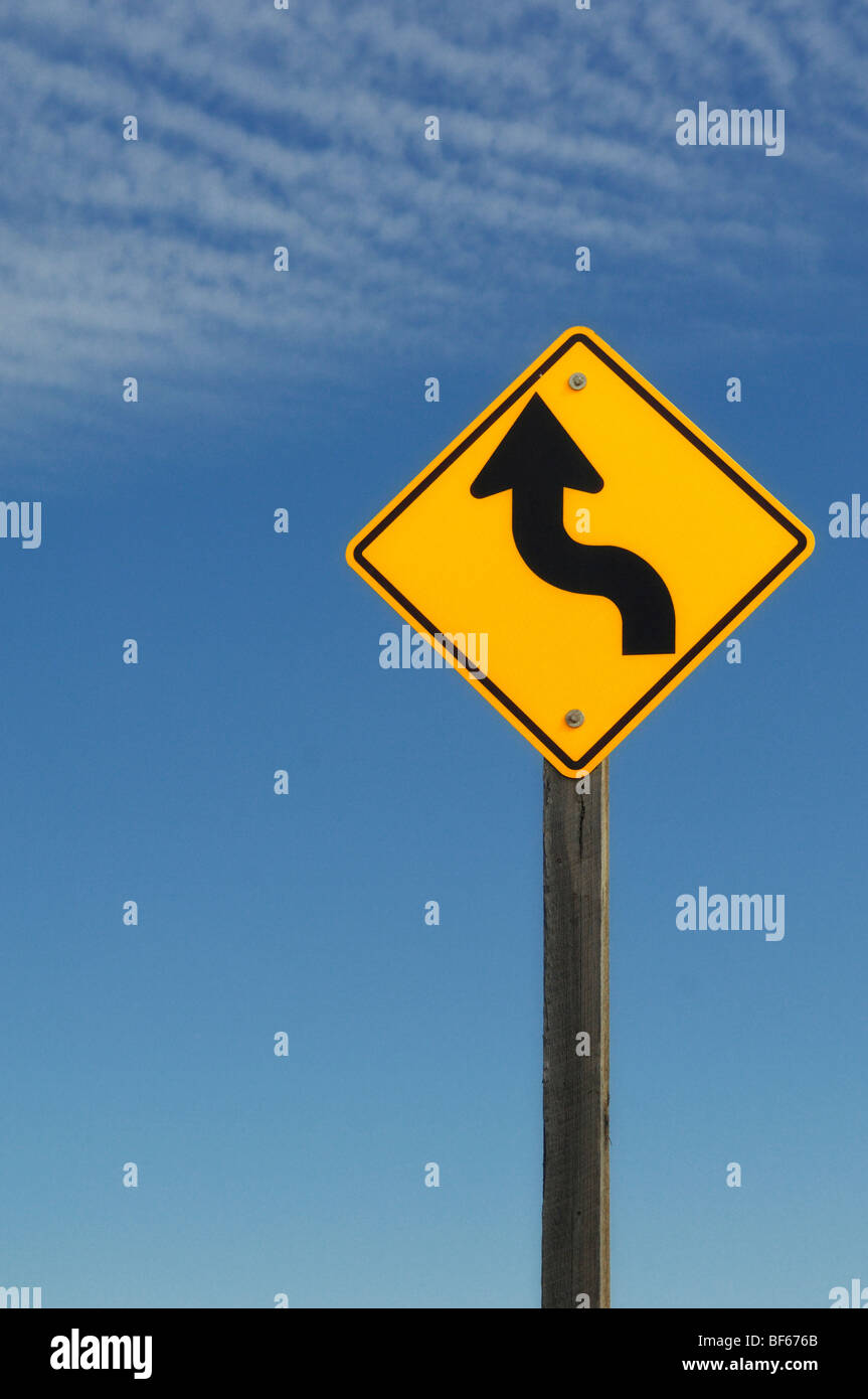 Winding road ahead sign Stock Photo - Alamy