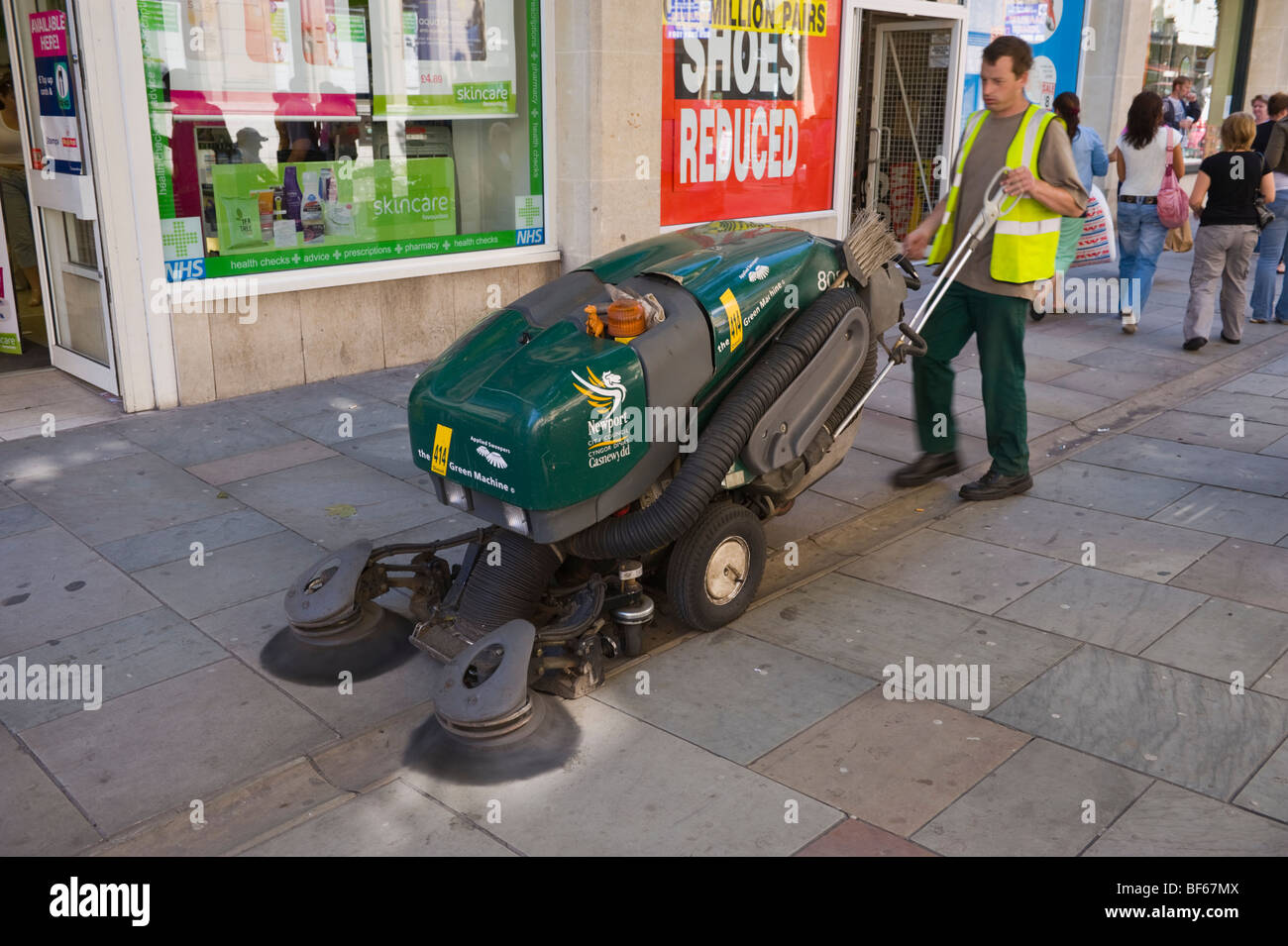 Man sweeping street hi-res stock photography and images - Alamy