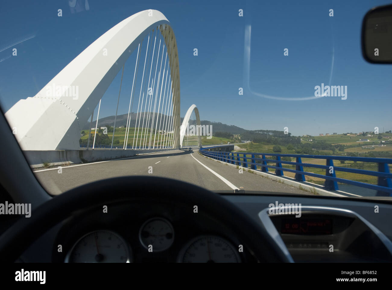 A highway suspension bridge as seen from the interior of a car on the A ...