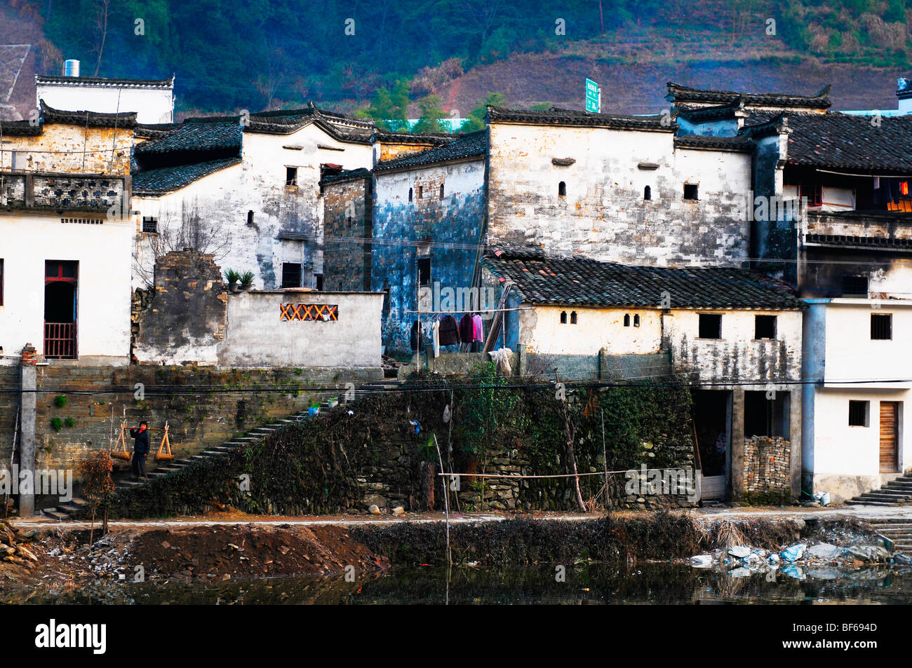 Traditional Hui style architecture on river side, Xiadan Village ...