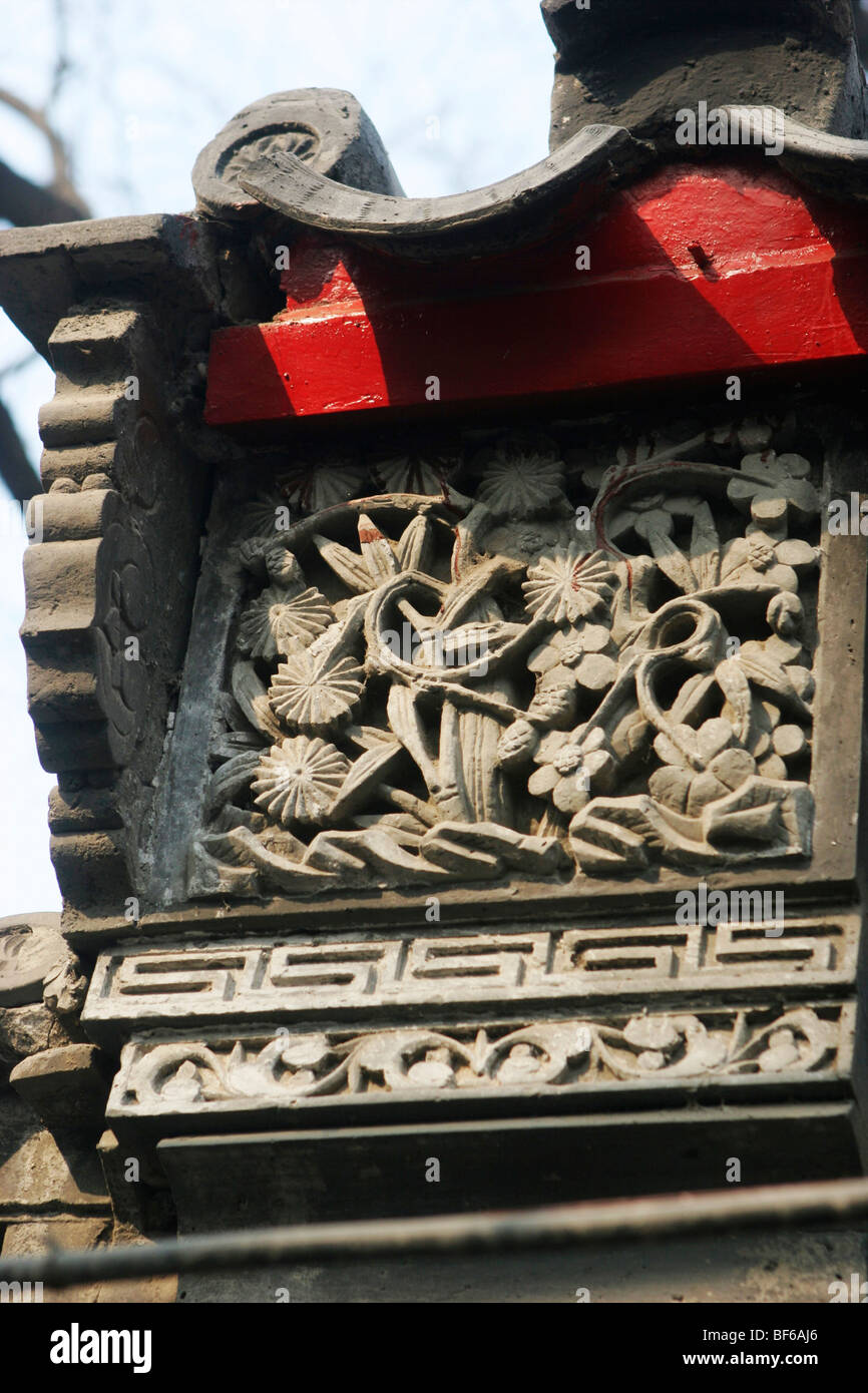 Gable board decorated with elaborate brick carving in a Hutong ...