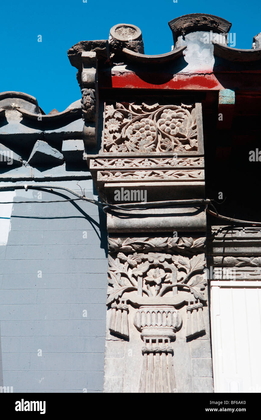 Gable board decorated with elaborate brick carving in a Hutong ...