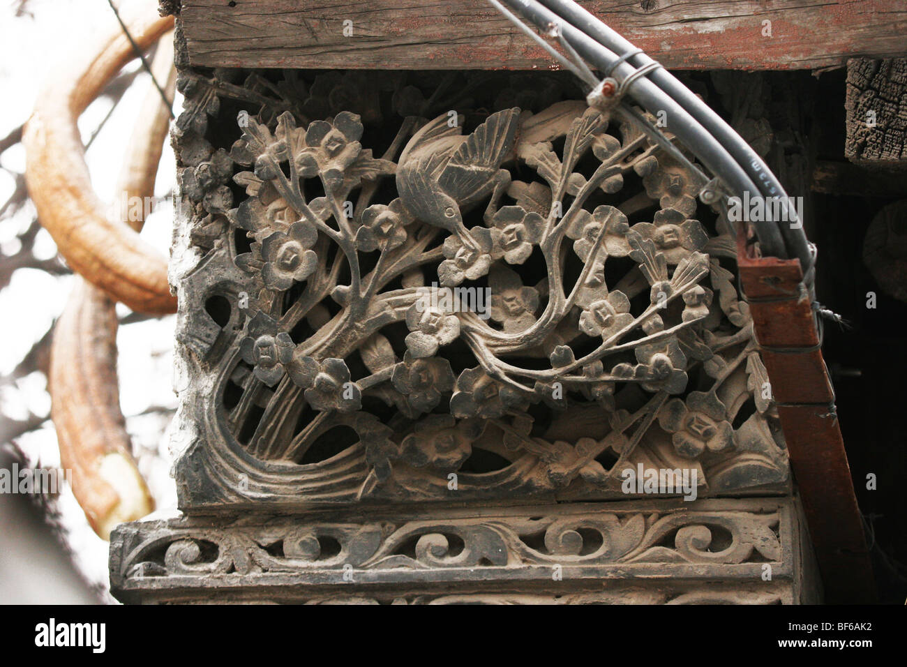 Gable board decorated with elaborate brick carving in a Hutong ...