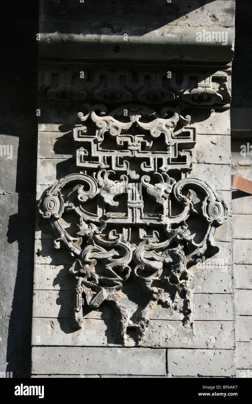 Gable board decorated with elaborate brick carving in a Hutong ...