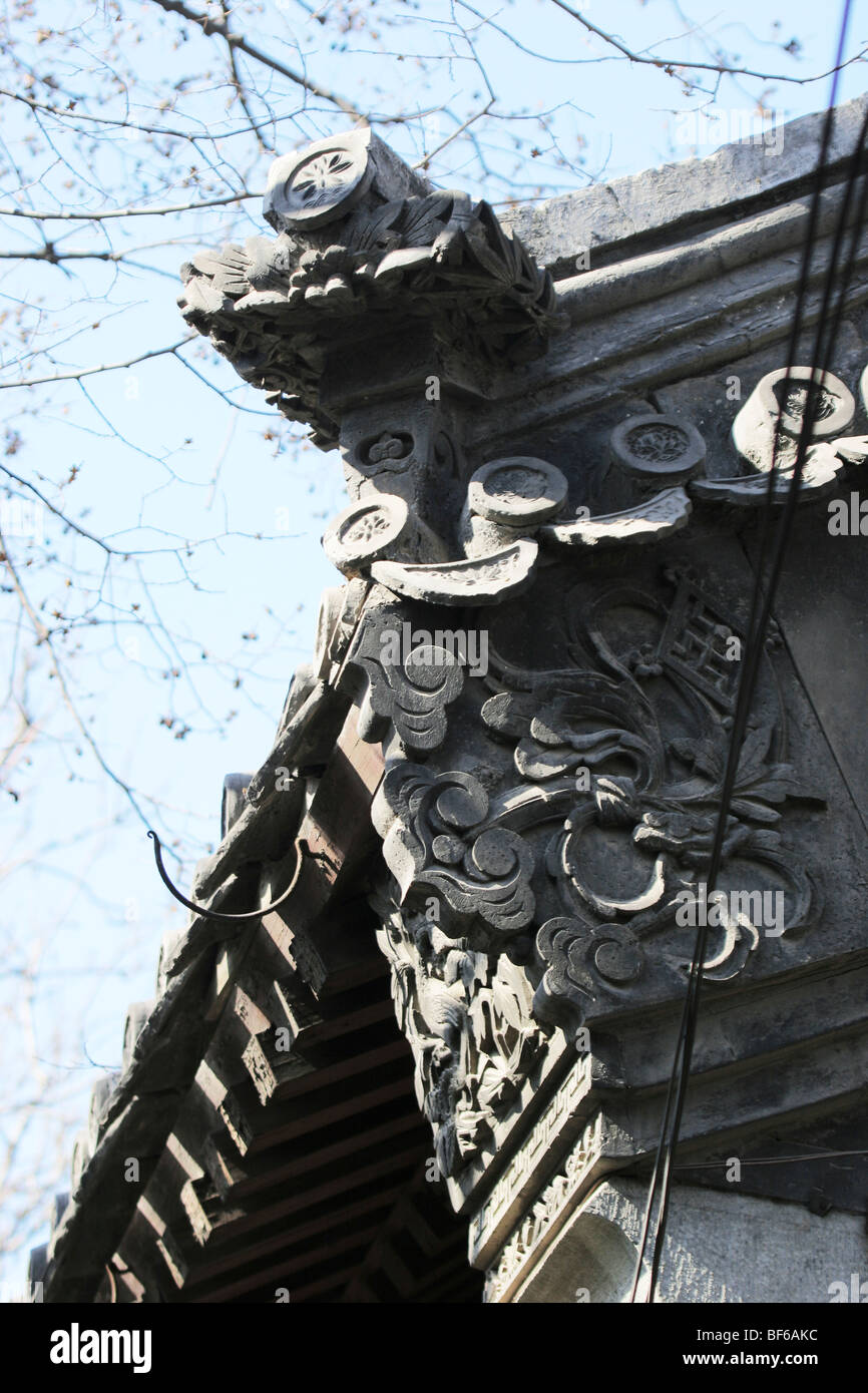 Gable board decorated with elaborate brick carving in a Hutong ...