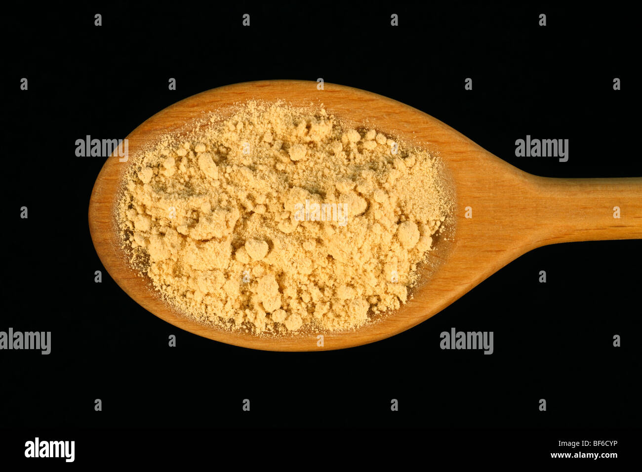Ground ginger on wooden spoon Stock Photo - Alamy
