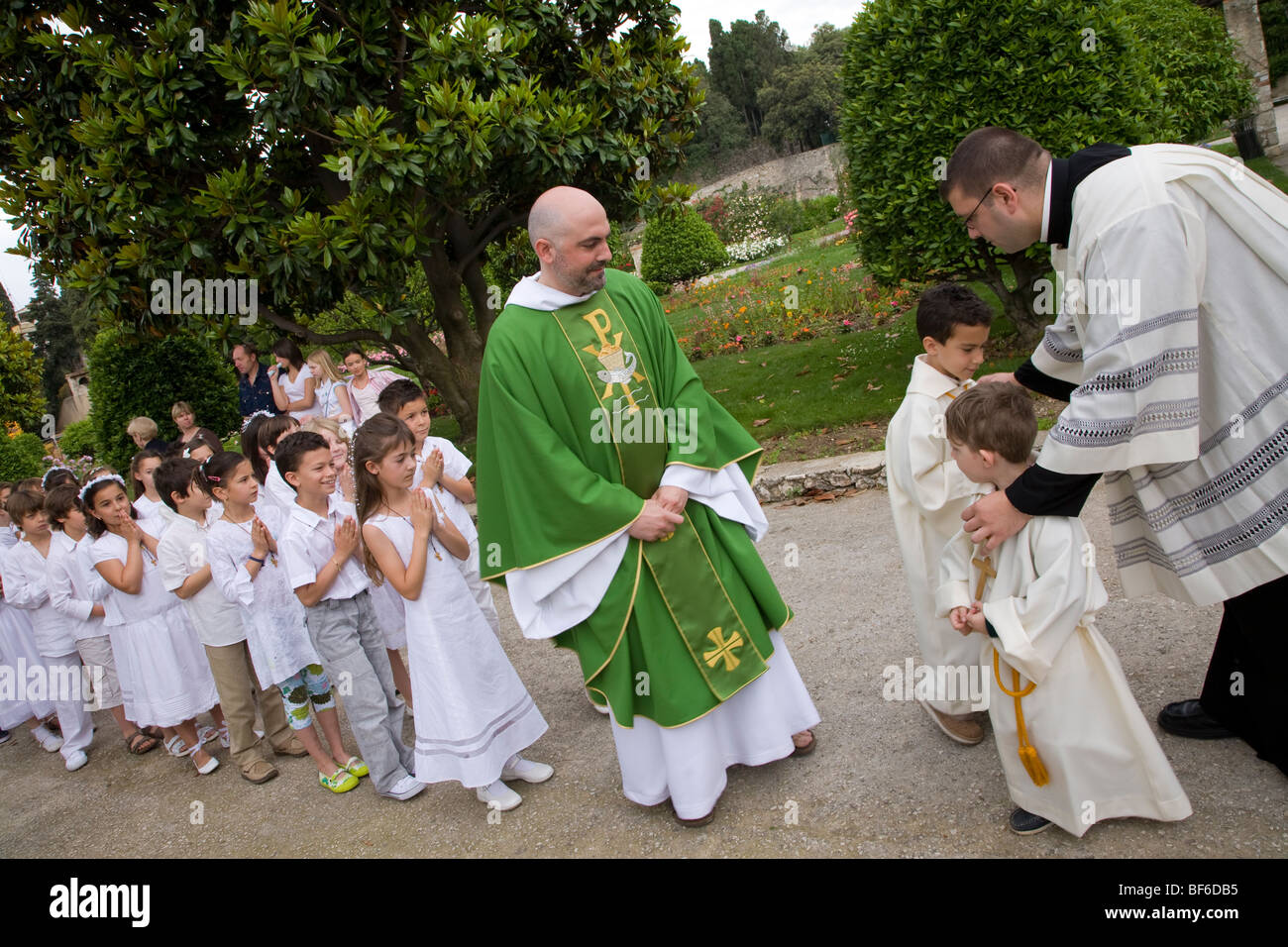 Priest and children hi-res stock photography and images - Alamy