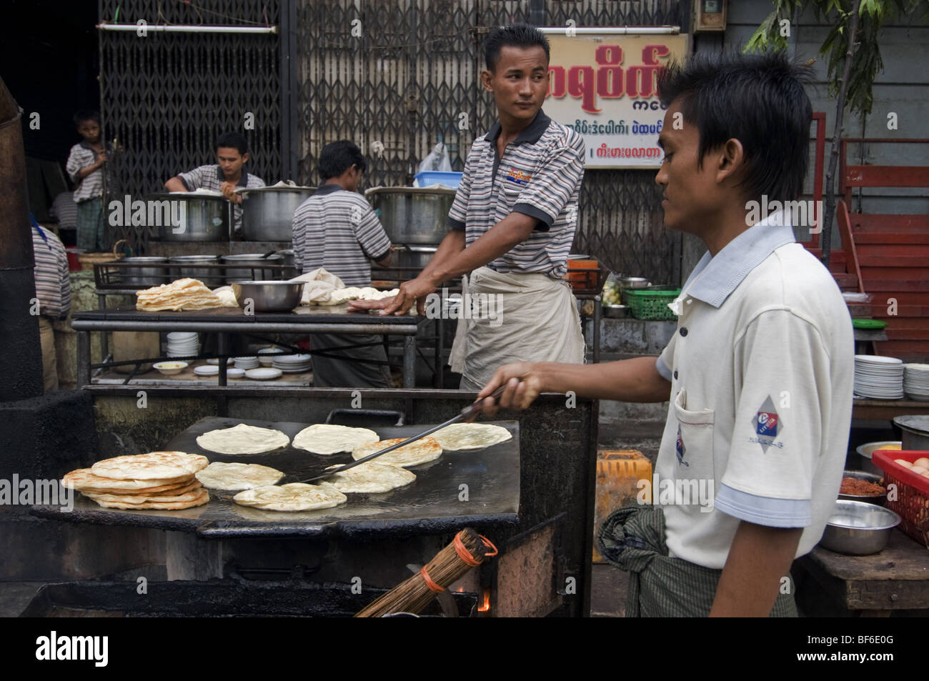 Workers at a chapati stand in Mandalay, Myanmar Stock Photo - Alamy
