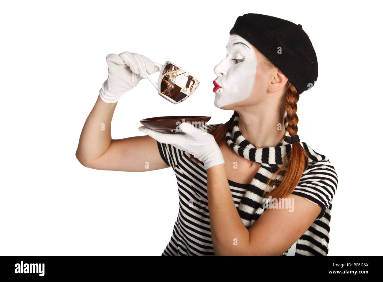Portrait of a young lady dressed up as a mime isolated on white ...