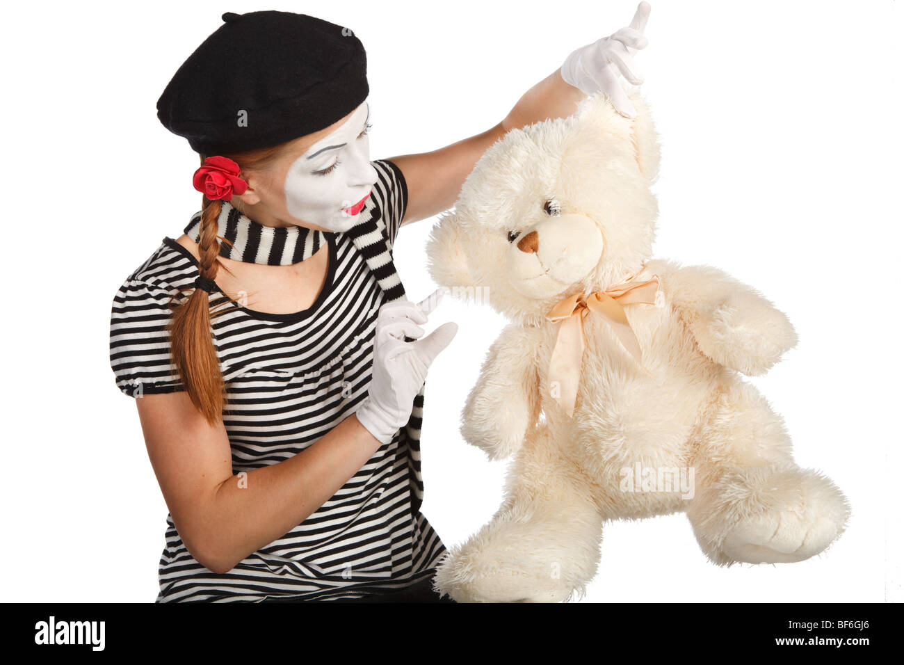 Portrait of a young lady dressed up as a mime isolated on white ...