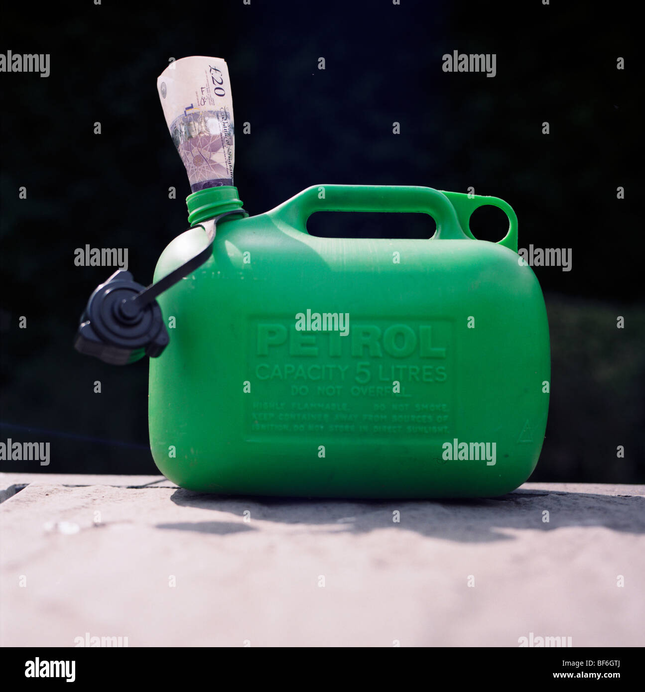 £20 note in green plastic petrol can Stock Photo - Alamy