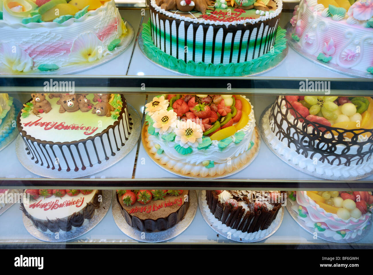 Colourful cakes in a shop window Stock Photo - Alamy